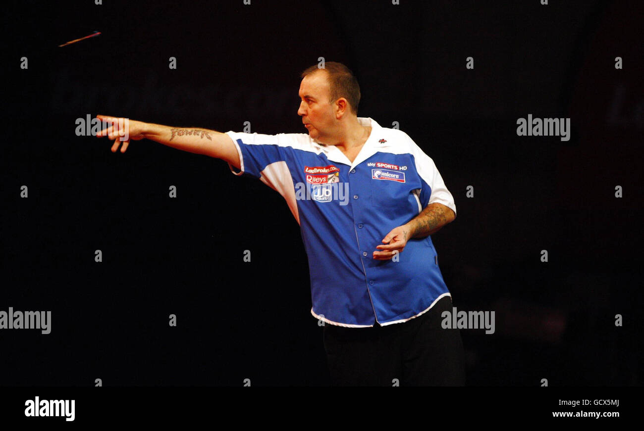 Phil Taylor in action against Gary Mawson during there first round ...