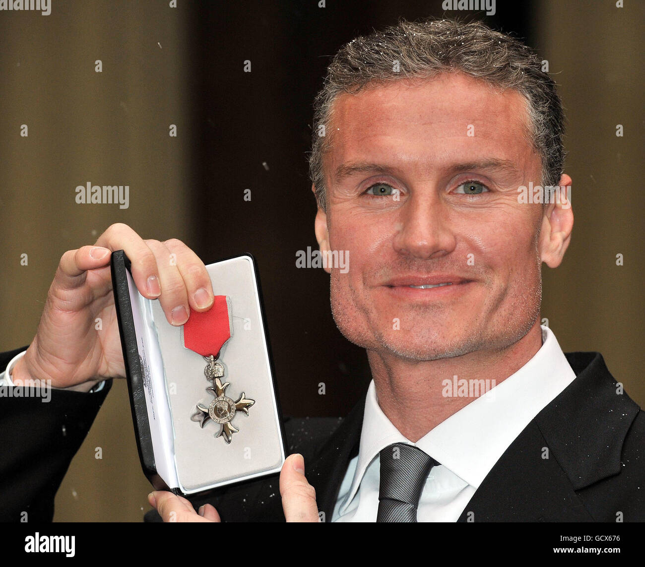 David Coulthard the former Formula one racing driver holds his MBE ... David Coulthard the former Formula one racing driver holds his MBE ...