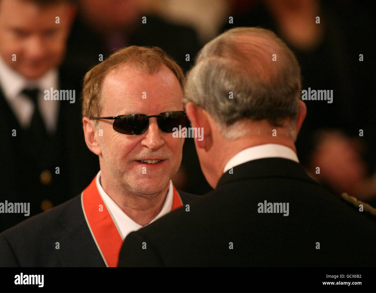 Robin Millar is made a CBE by the Prince of Wales during an Investiture ...