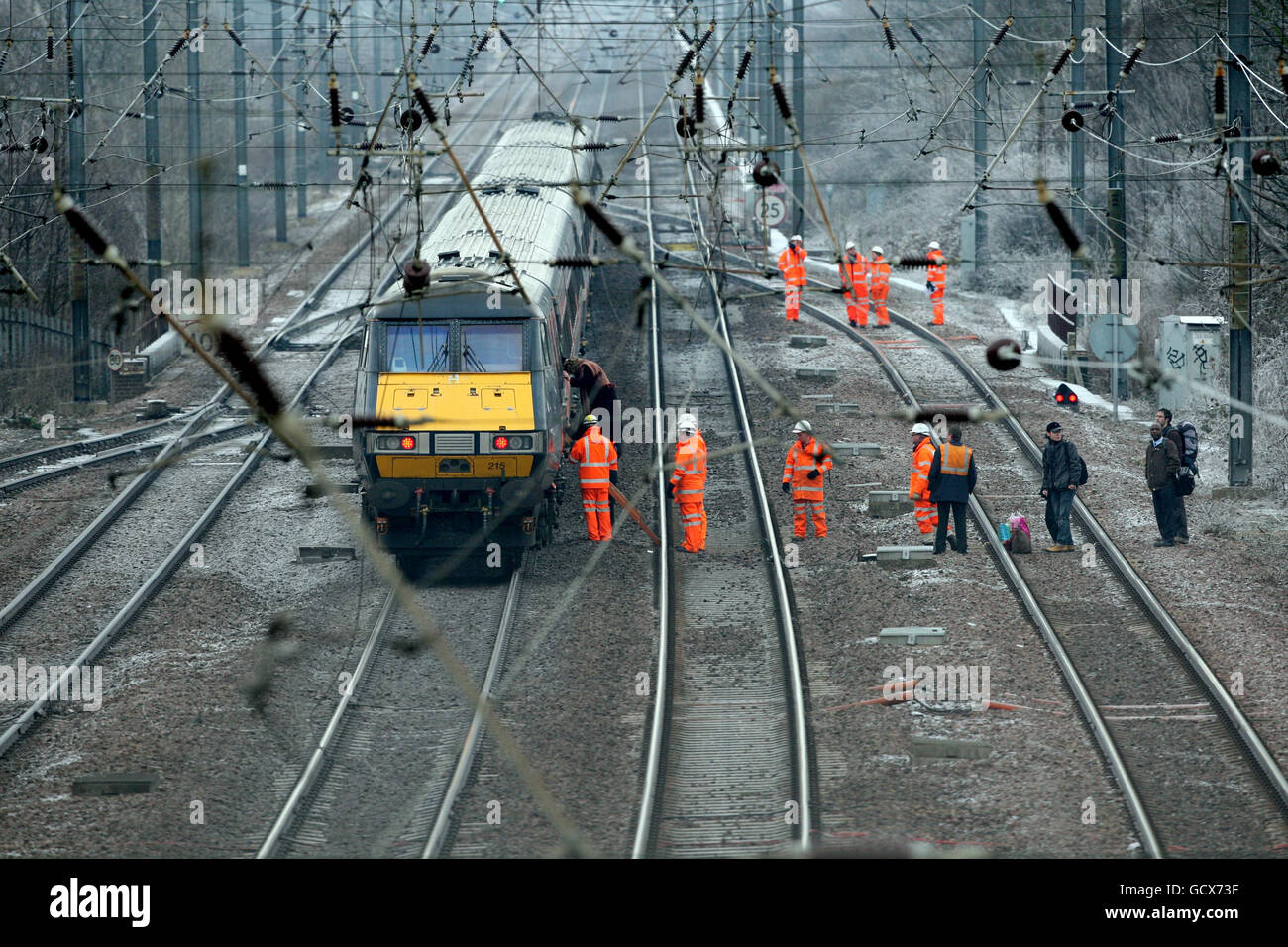 Passengers are led off a train outside Huntingdon Railway station in ...