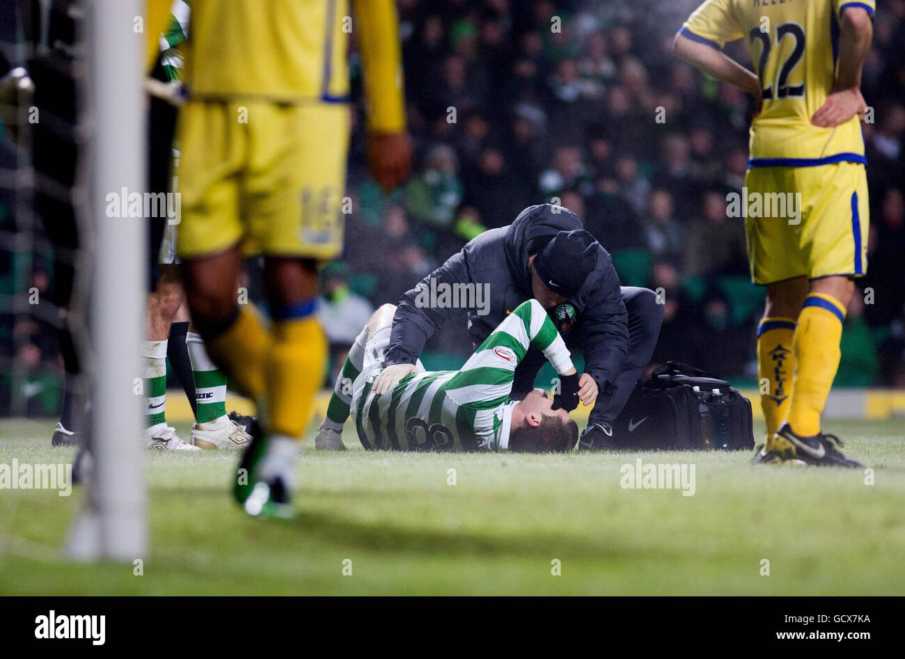 Celtic's Gary Hooper lies with an injury during the Clydesdale Bank ...