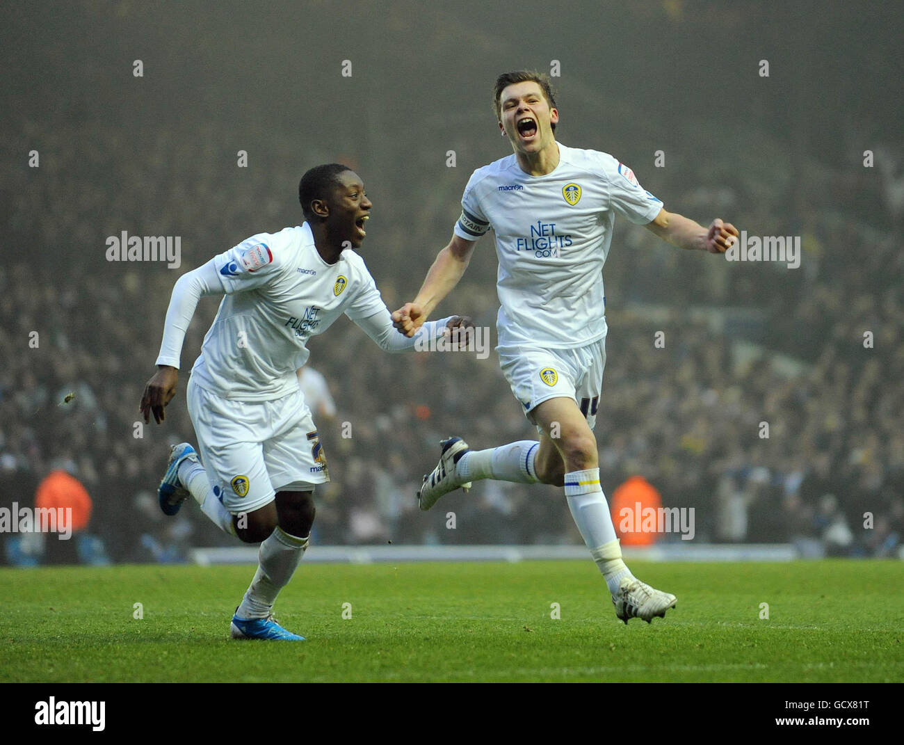 Leeds' Jonathan Howson (right) celebrates with team-mate Max Gradel ...