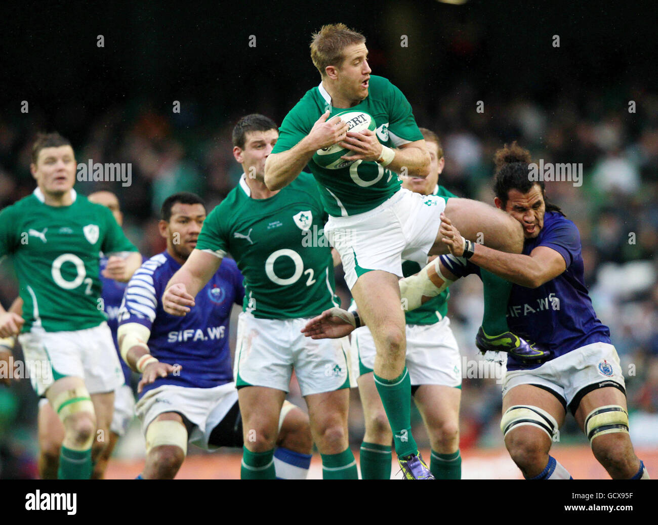 Ireland's Luke Fitzgerald jumps with Samoa's Manaia Salavea during the ...