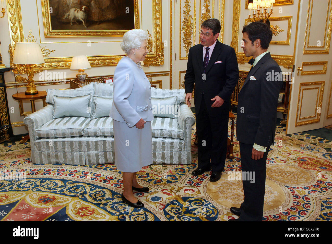 Queen Elizabeth II meets Mr Rana Dasgupta (right) who has won the ...