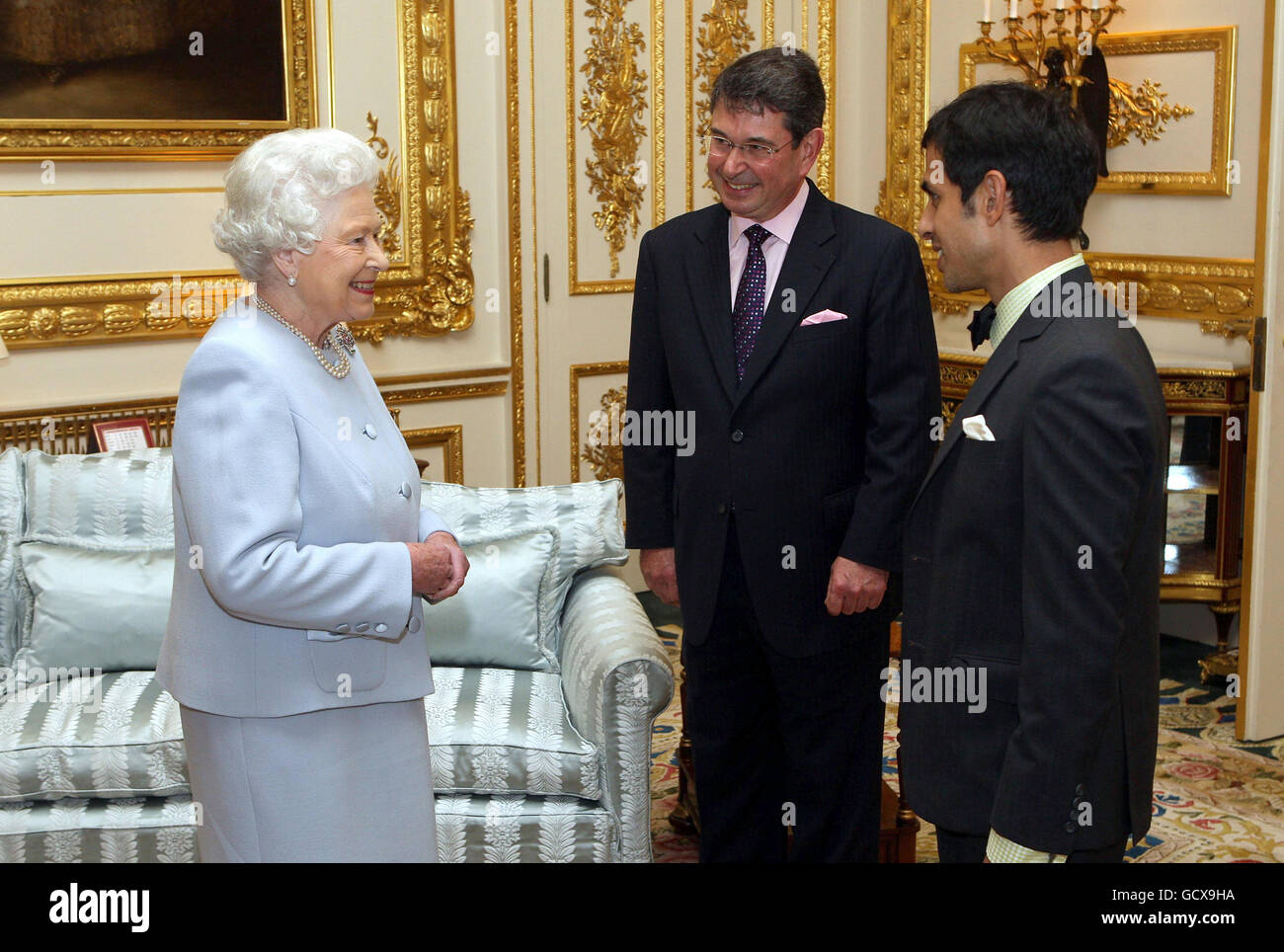 Queen Elizabeth II meets Mr Rana Dasgupta (right) who has won the ...