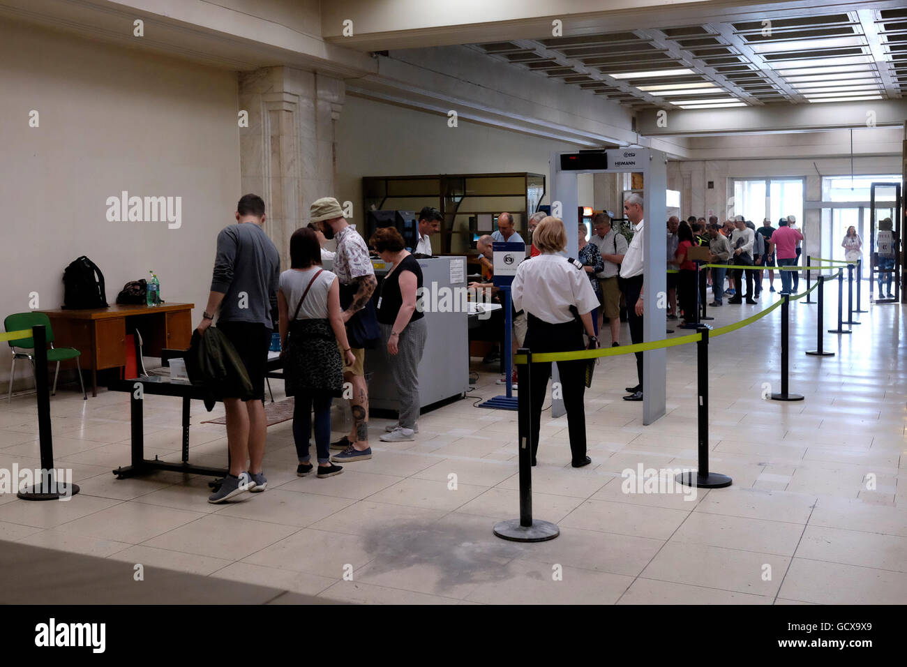 Security guards check visitors bags at a security checkpoint at ...