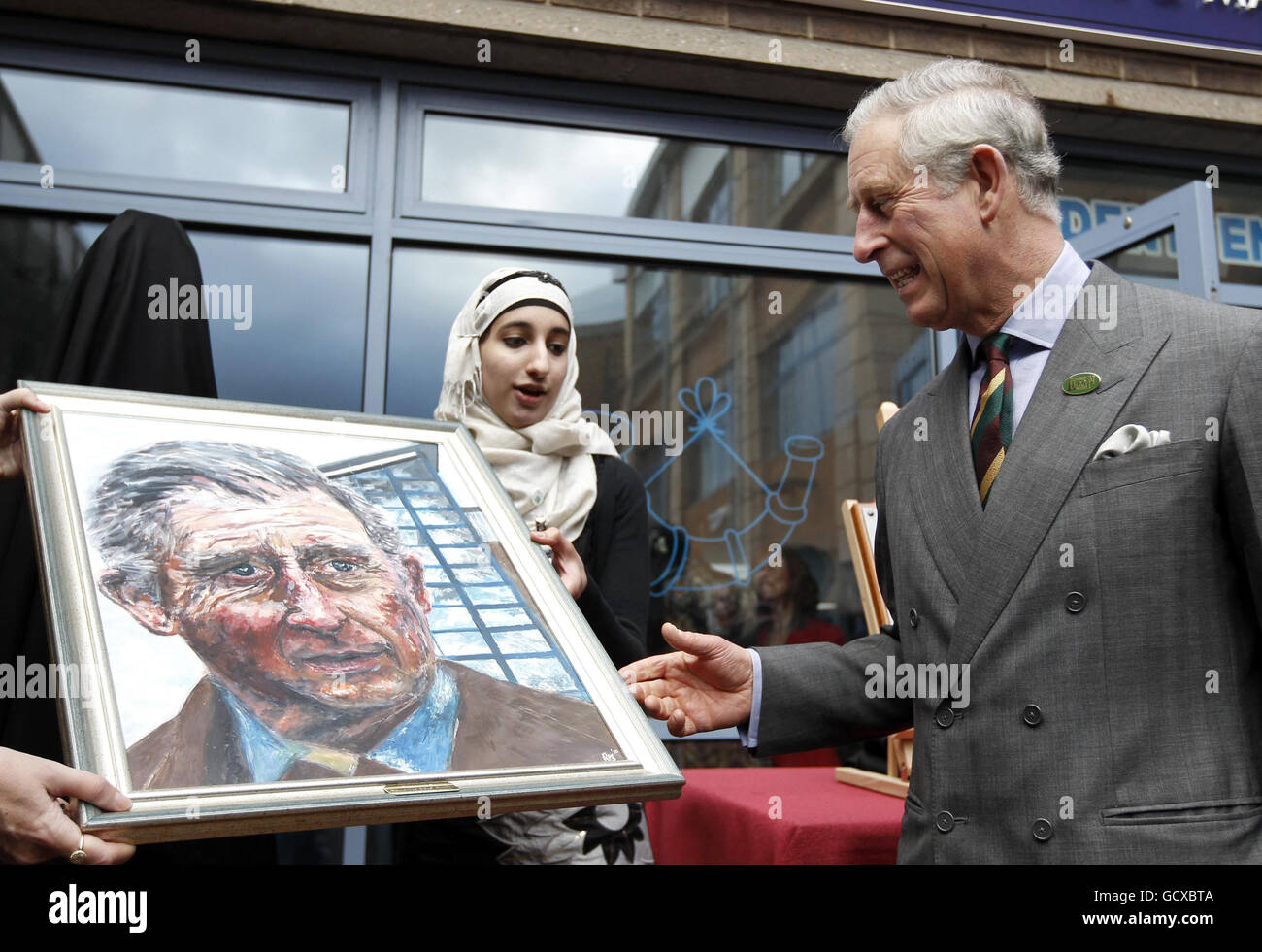 The Prince of Wales is presented with a portrait of himself painted by ...