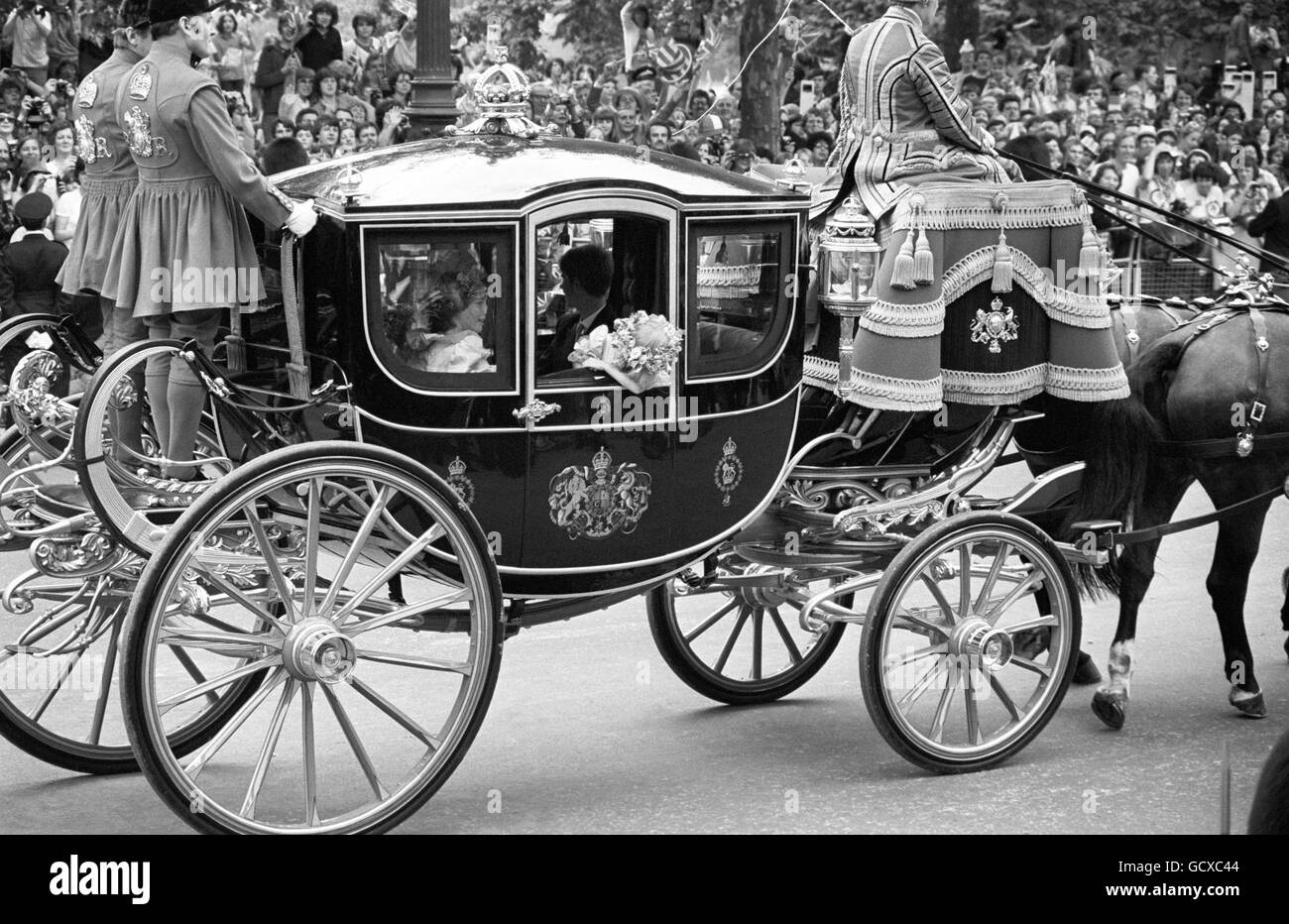 One of the bridesmaids of Lady Diana Spencer looks out of the carriage ...