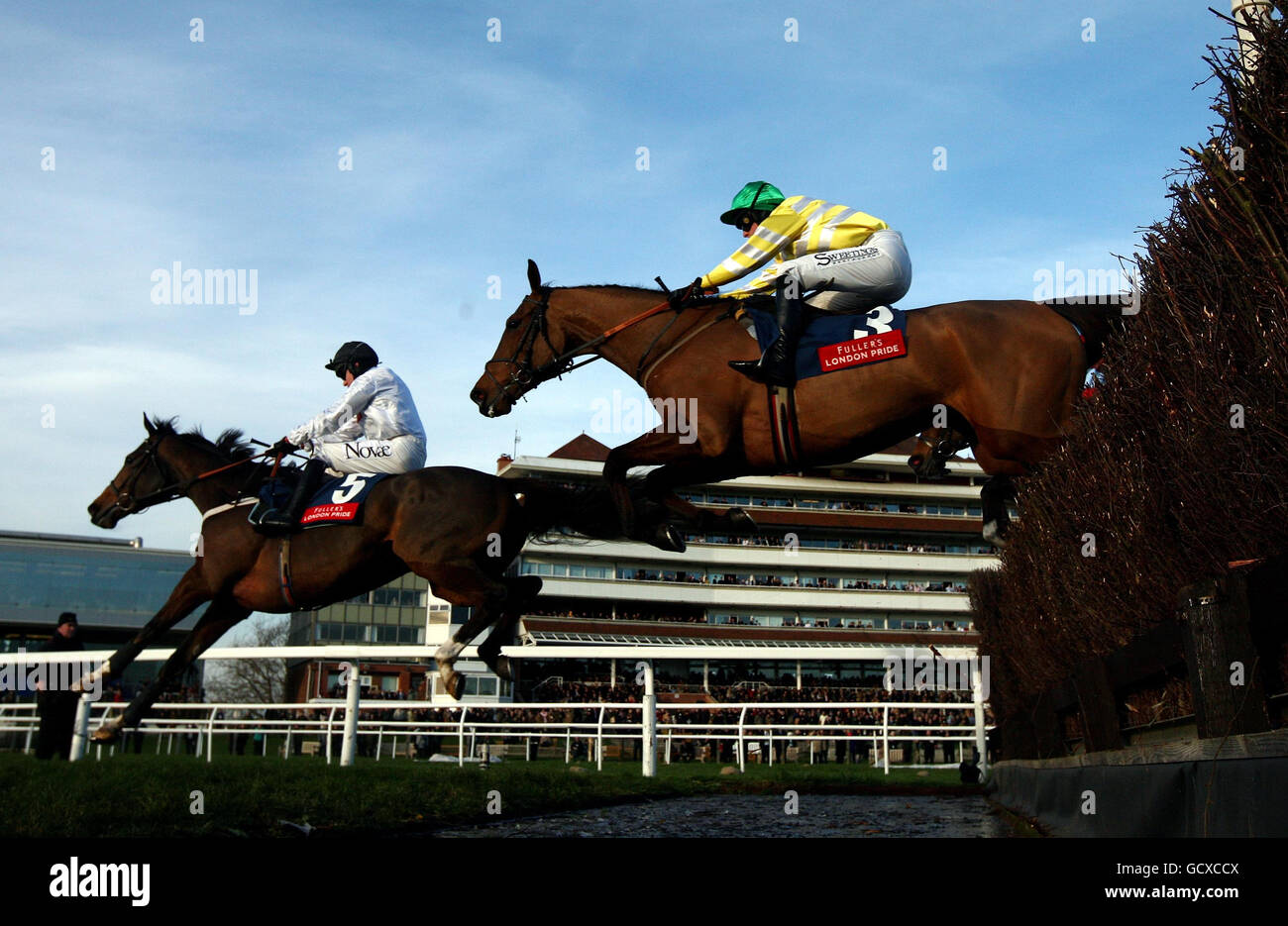 Cois Farraig ridden by Dominic Elsworth jumps the waterjump in second ...