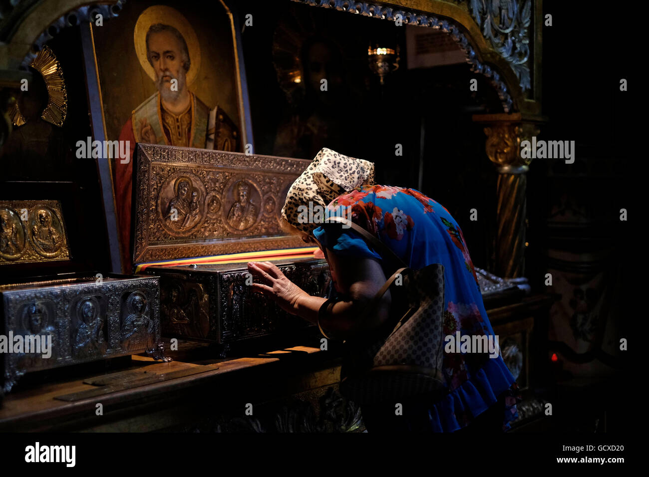A Romanian woman praying inside Saint George New Church ( Biserica ...