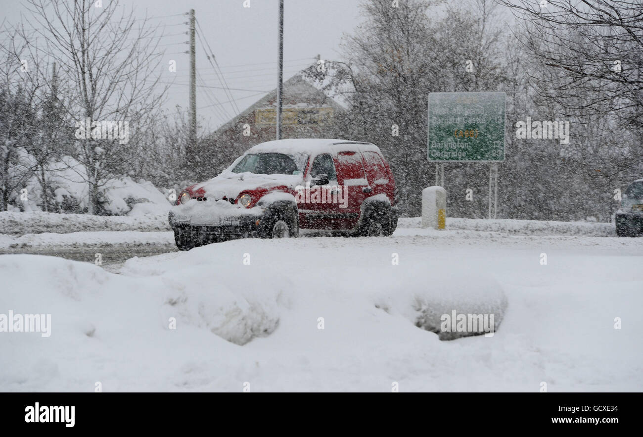 A car makes it way through the snow in Bishop Auckland in County Durham ...