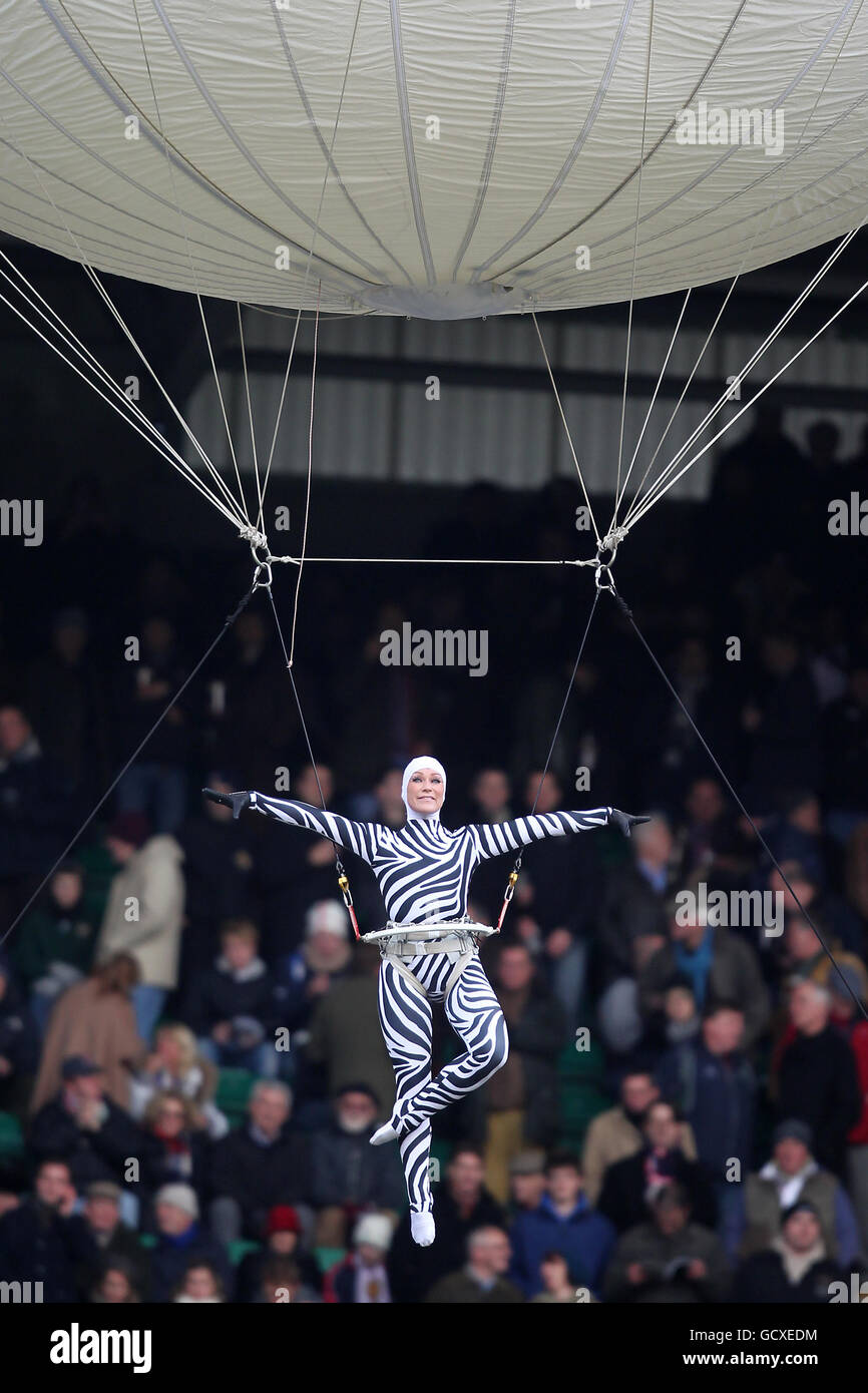 An Aerial acrobat entertains the crowd before kick off Stock Photo - Alamy