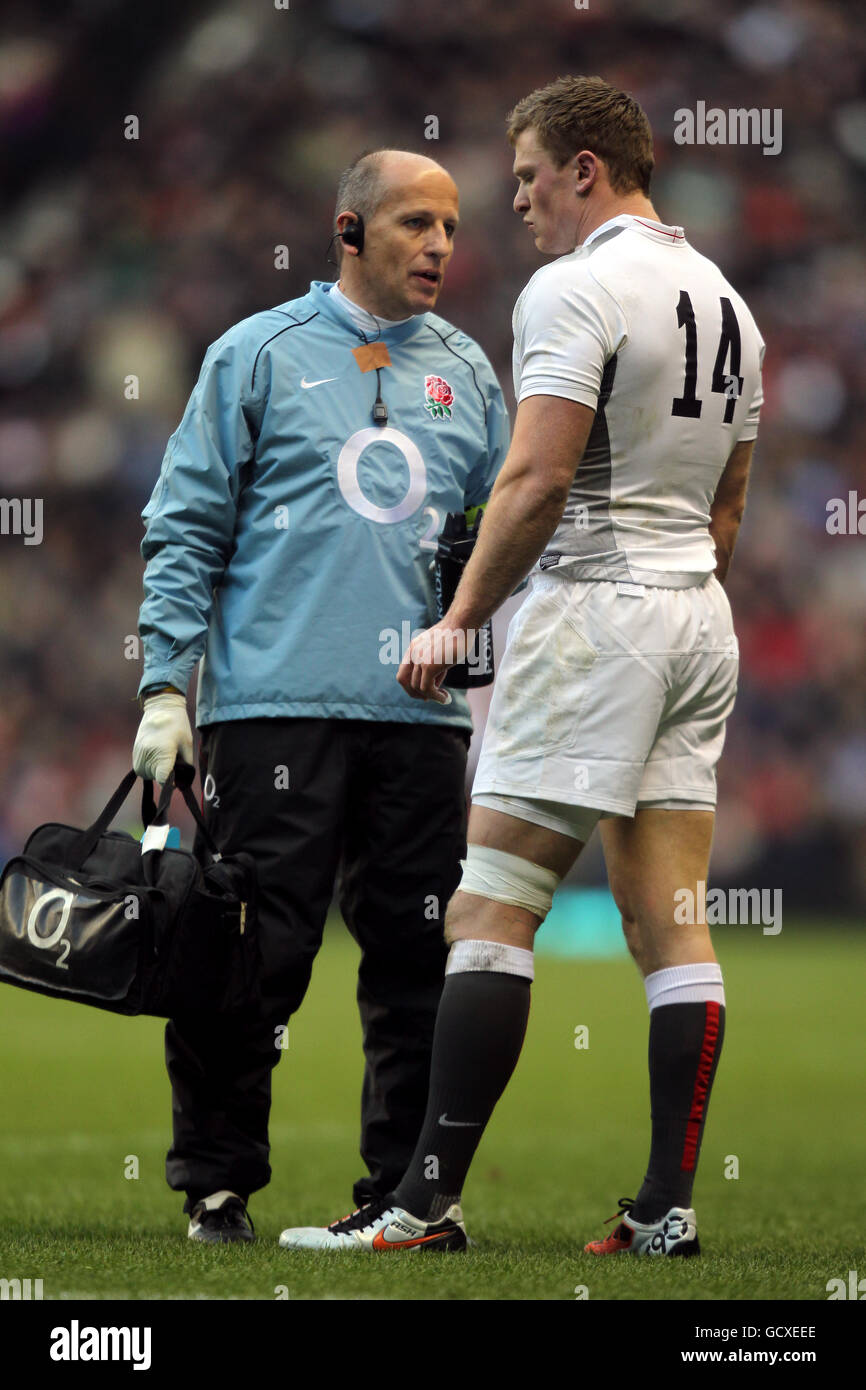 Englands chris ashton is spoken to by a physio hi-res stock photography ...