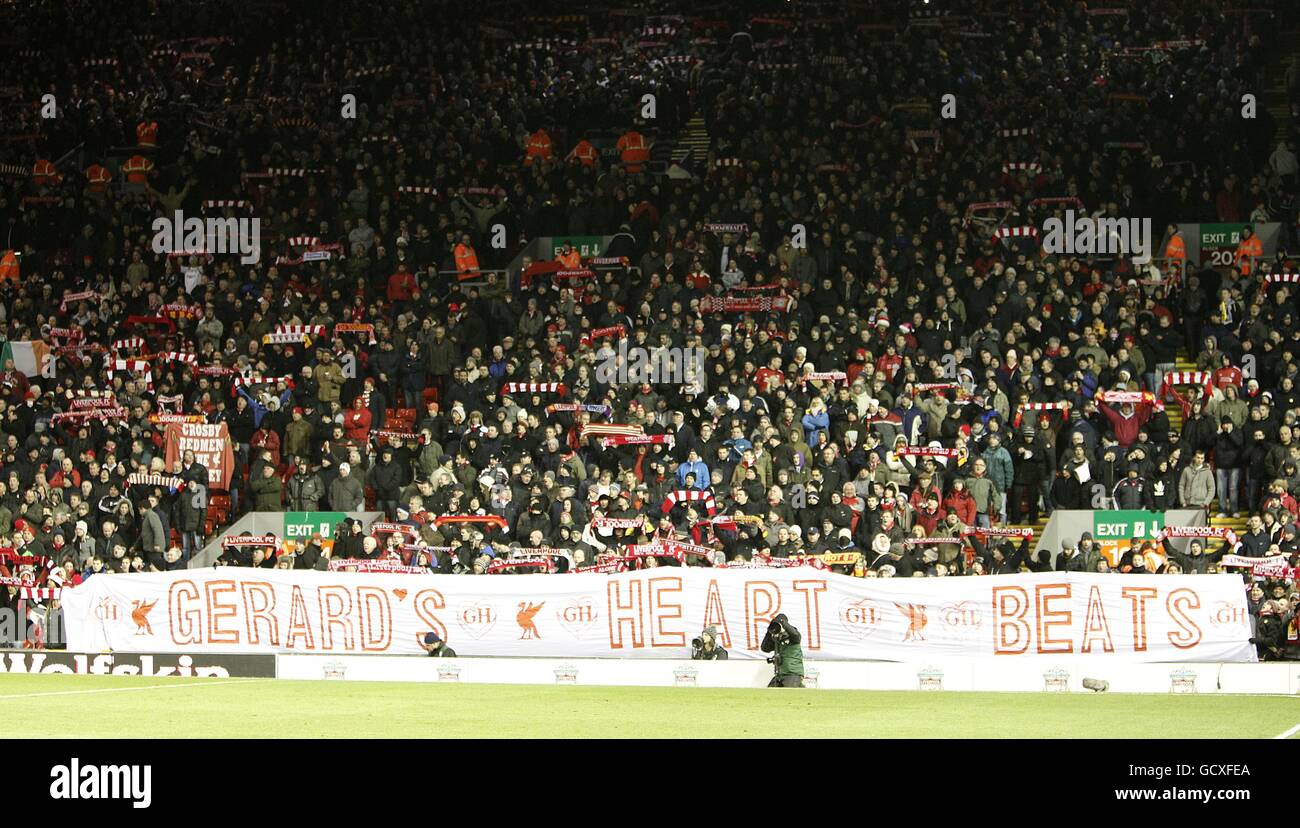Liverpool fans hold up a banner as a tribute to their former manager ...