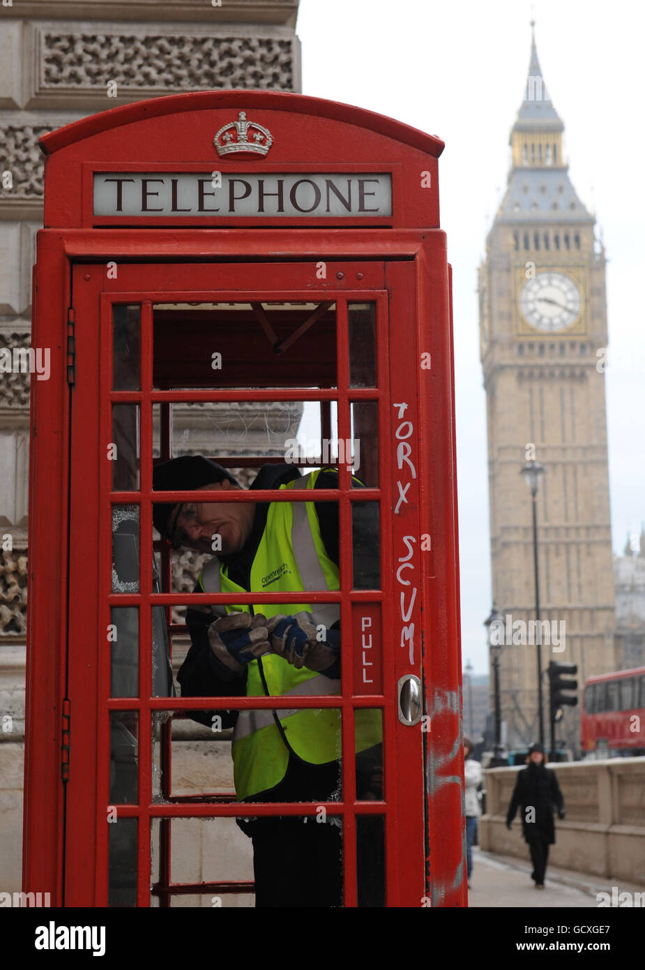 A telephone box in Parliament Square this morning is repaired and ...