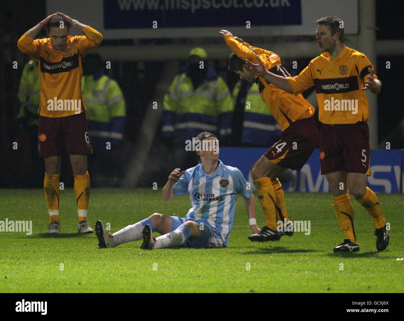 Heart's David Templeton is fouled by Motherwell's Stephen Craigan for a ...