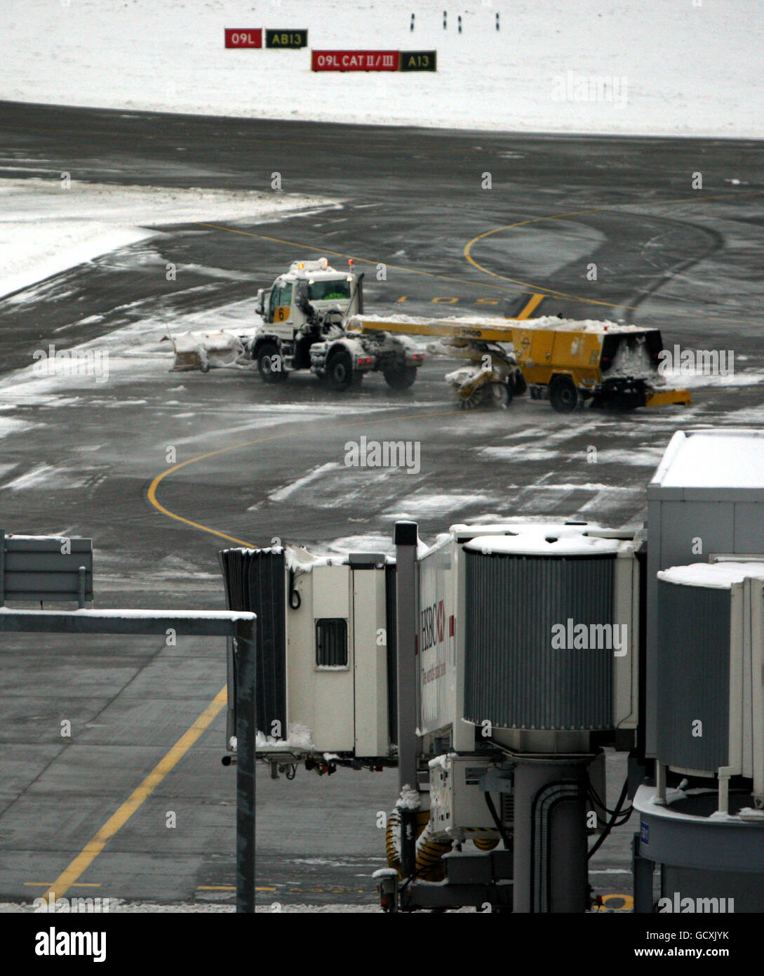 A snow plough clears taxi ways near Terminal 5 of Heathrow Airport ...