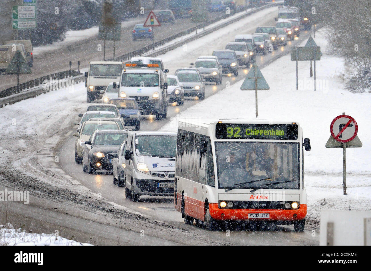 Traffic crawls through a snow shower outside Chippenham as snow sweeps ...