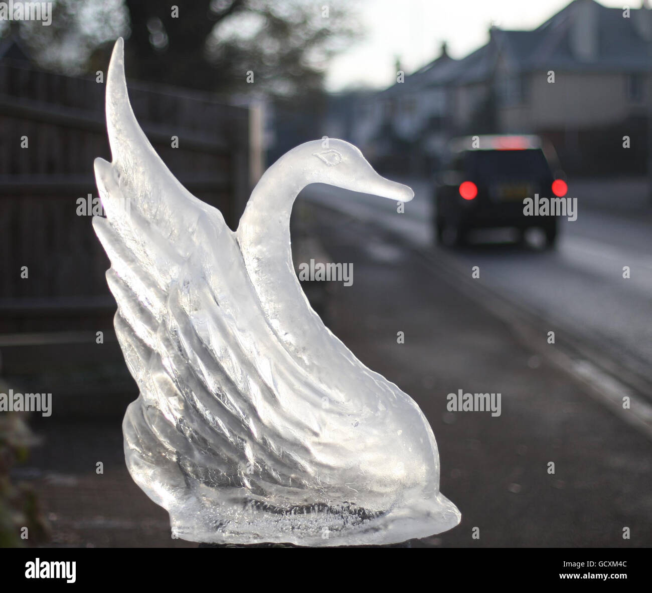 A swan made from ice looks out on a road in Poole, Dorset, where ...