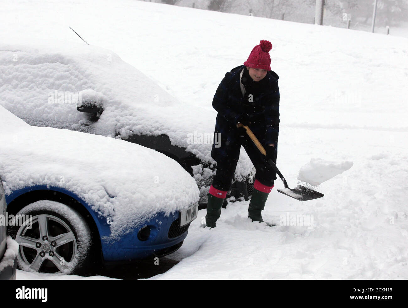 Woman name given clears snow from her car near denny hi-res stock photography and images - Alamy
