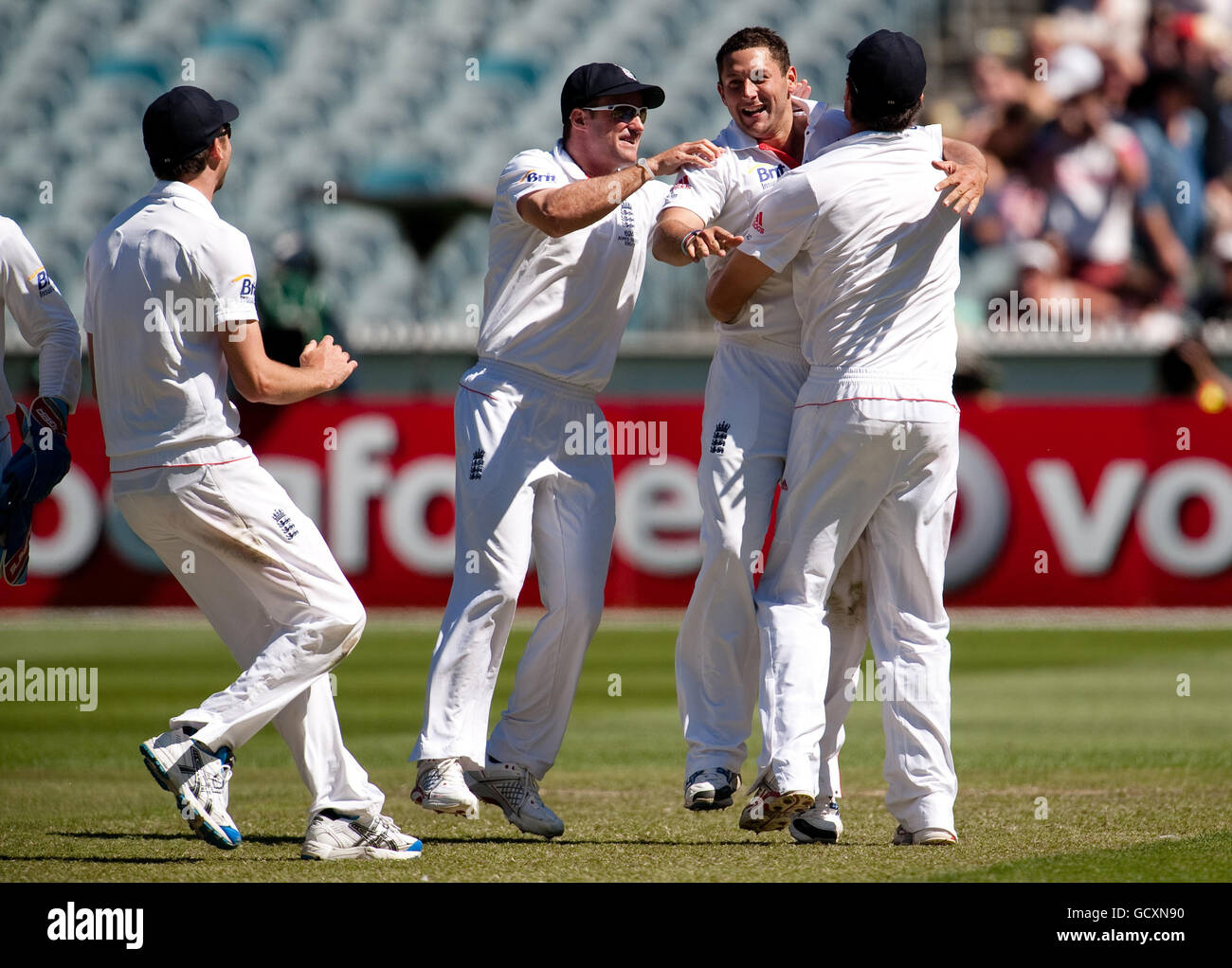 England's Tim Bresnan celebrates with captain Andrew Strauss and ...