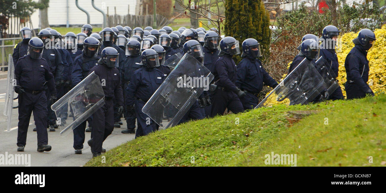 Specialist prison officers escort fire fighters in to HMP Ford near ...