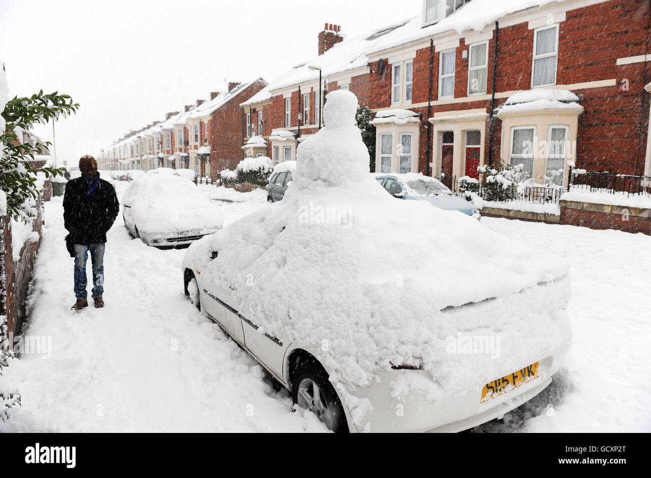 A snowman on top of a car as roads around Newcastle were blocked by ...