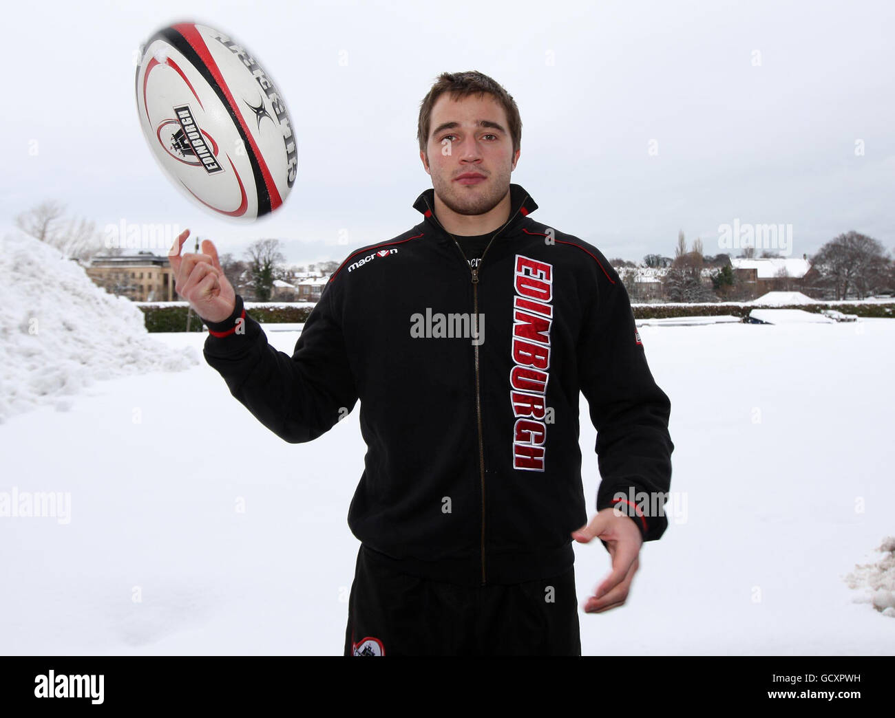 Edinburgh Rugby's Alex Grove poses in front of lying snow following the ...