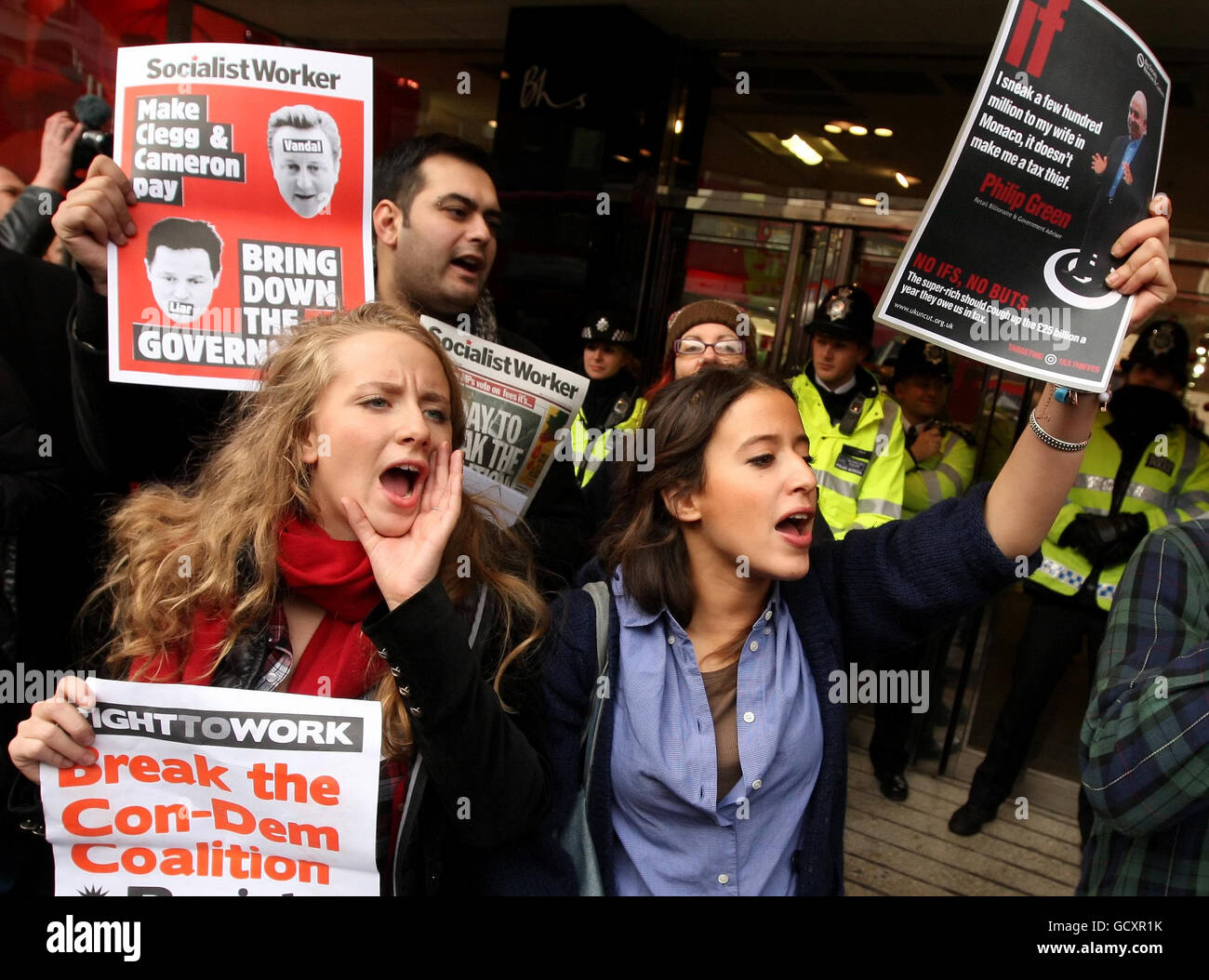 Demonstrators from the UK Uncut group outside Topshop, on Oxford Street ...