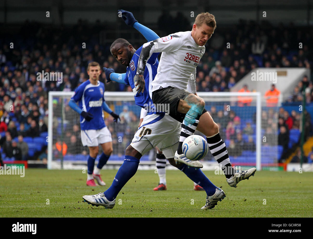 Ipswich Town's Jason Scotland and Swansea City's Mark Gower battle for ...