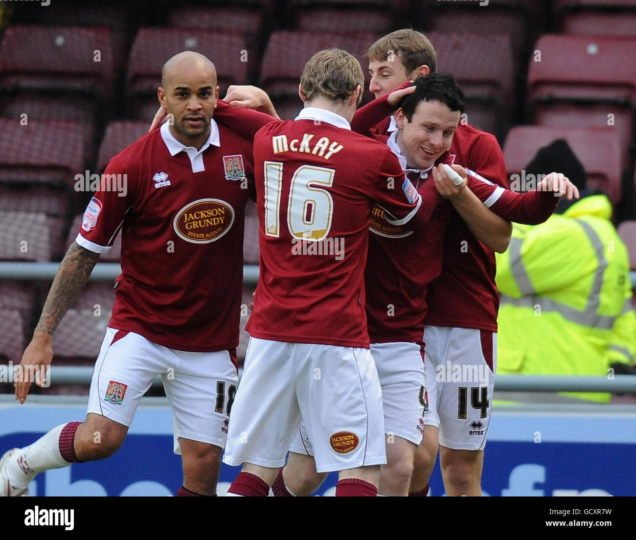 Northampton Town's Kevin Thornton (4) celebrates with his team mates ...