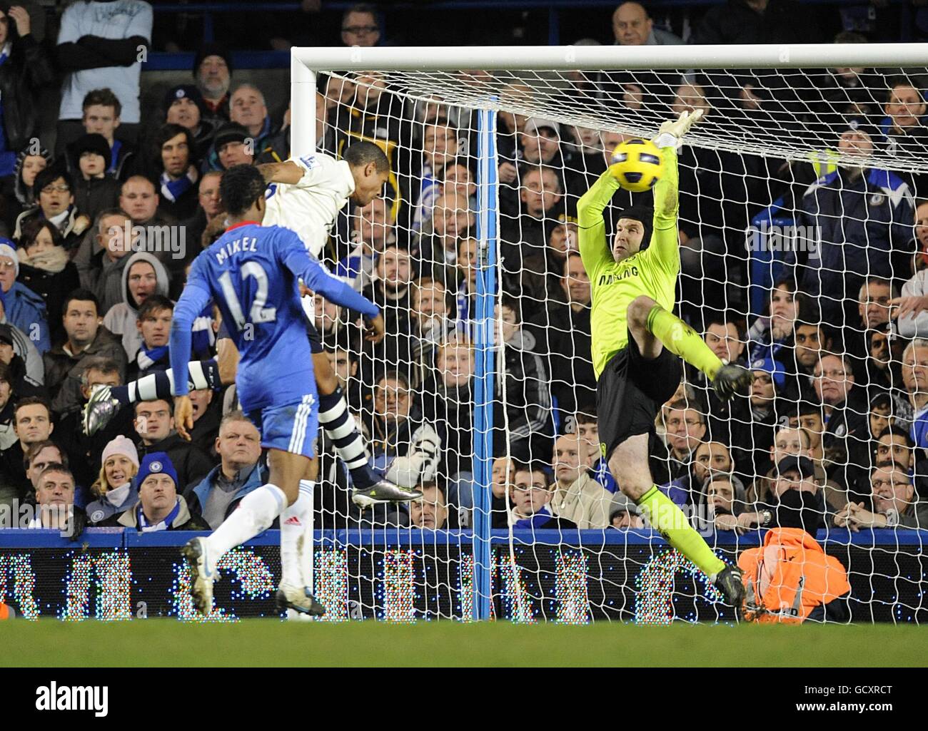 Everton's Jermaine Beckford (left) heads in the equaliser past Chelsea ...