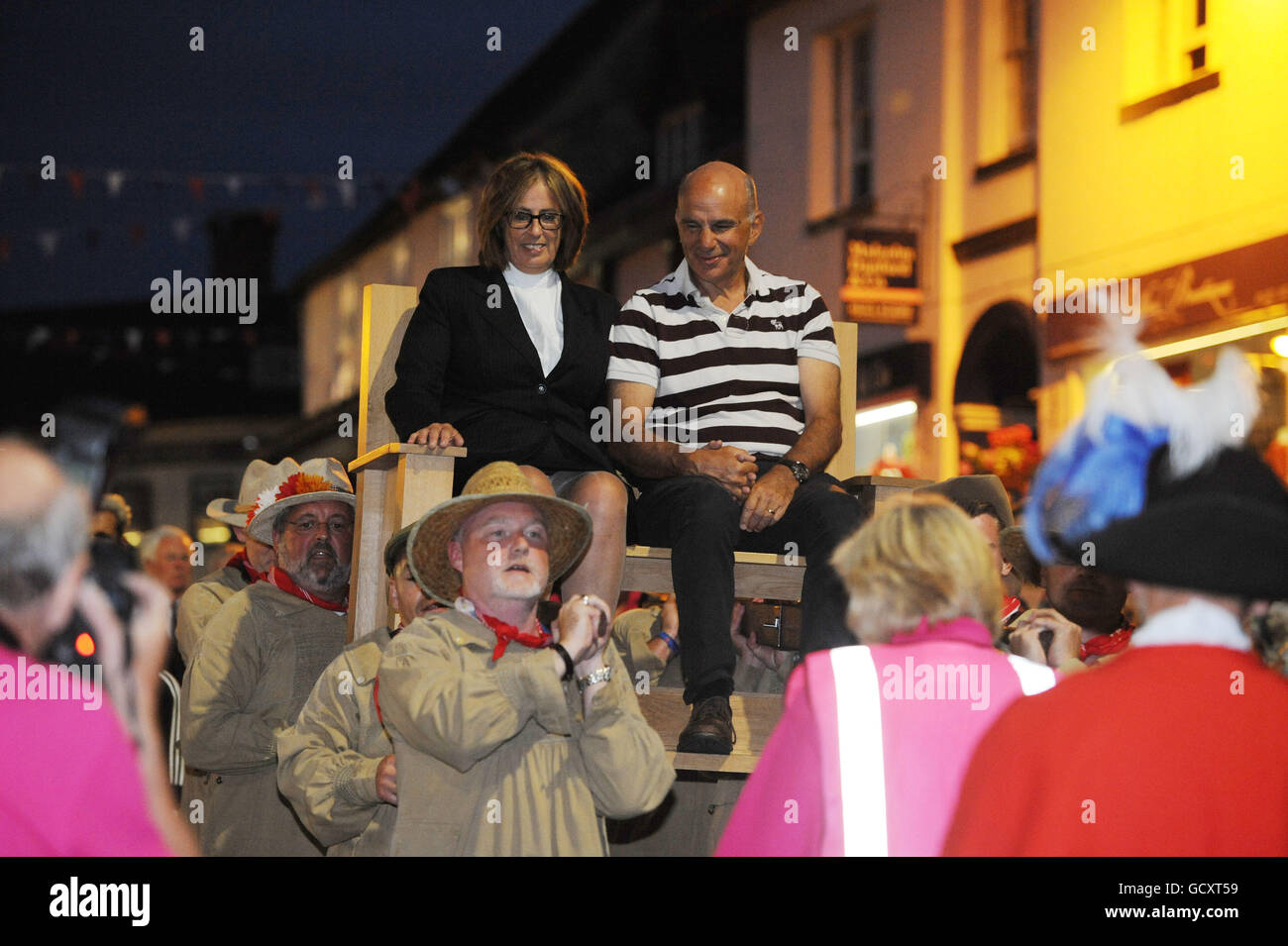 Winning couple Caroline and Geoffrey Parkes are carried during the ...