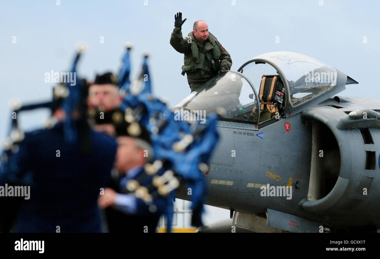 Wing Commander Simon Jessett waves from the Harrier cockpit after the ...