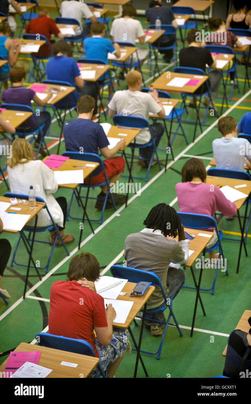 A-level students sit an A-level maths exam inside a sports hall Stock ...