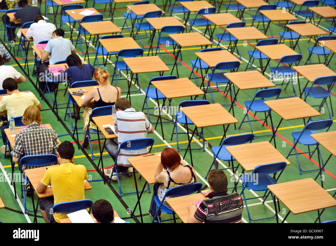 A level students sit an a level maths exam inside sports hall hi-res ...