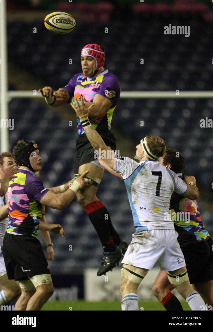 Glasgow's Ritchie Vernon and Edinburgh's Netani Talei (centre) during ...