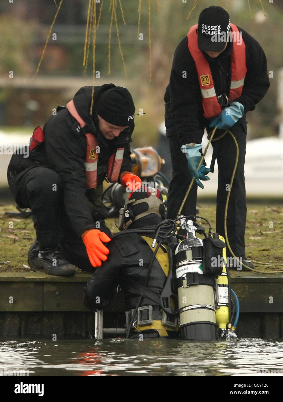 A police diver searches a stretch of the river Thames near Pharaoh's ...