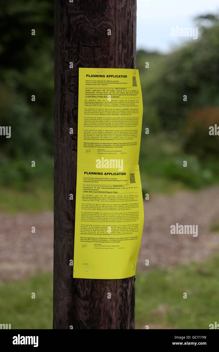 Yellow planning application poster stuck to a telegraph pole in Pagham ...