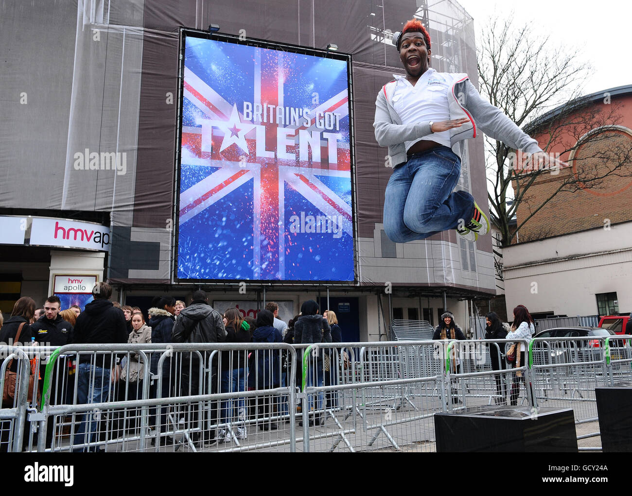 Wisdom Nwaogu, 21, from North Kensington jumps from a box as he queues ...