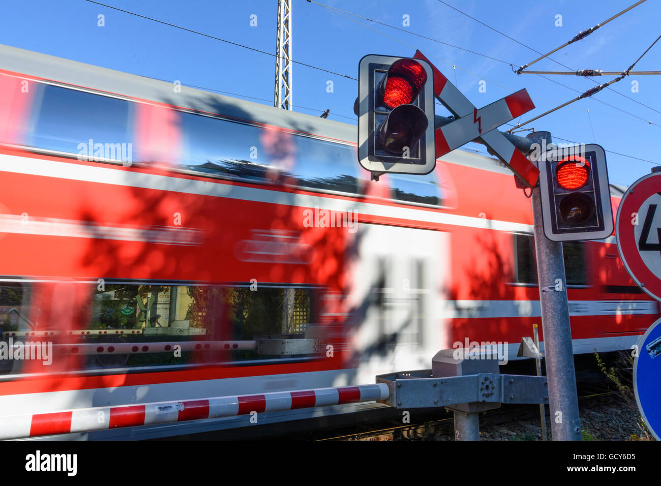 Railroad crossing with train germany sachsen hi-res stock photography ...