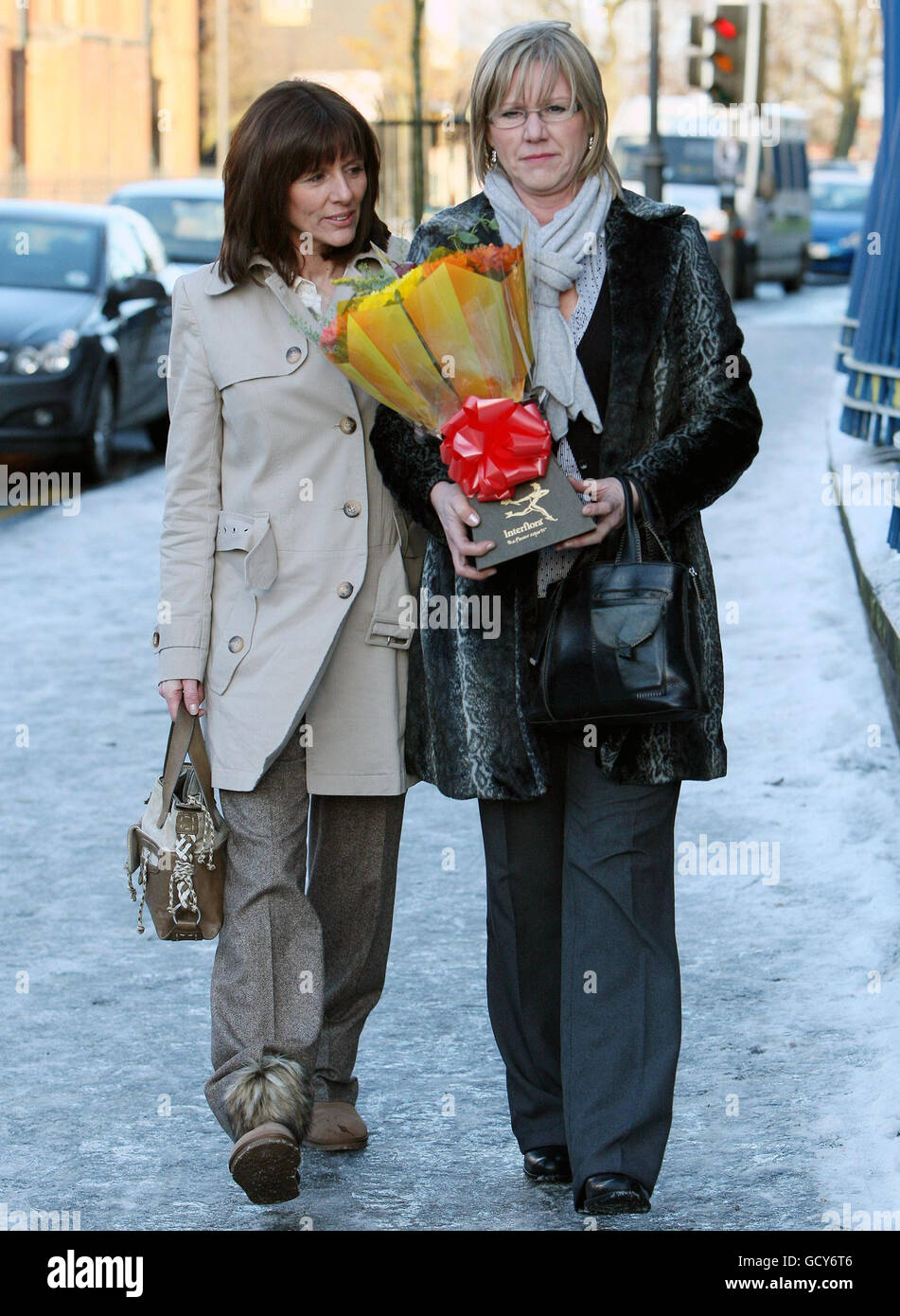 Karyn Jackson (left) with her sister Louisa lays flowers at the Royal ...