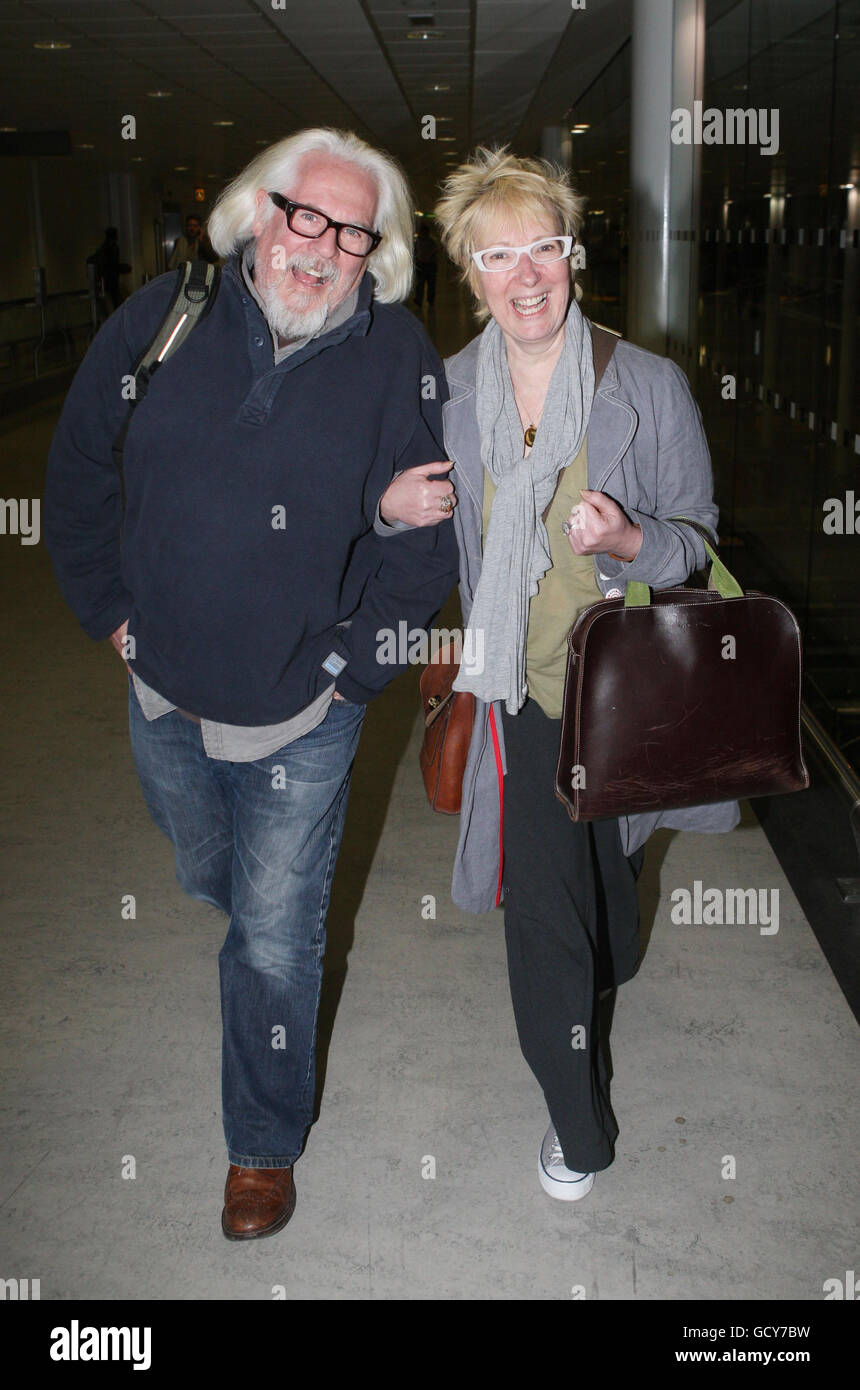 Comedian Jenny Eclair with her partner Geoff Powell arrive at Heathrow ...