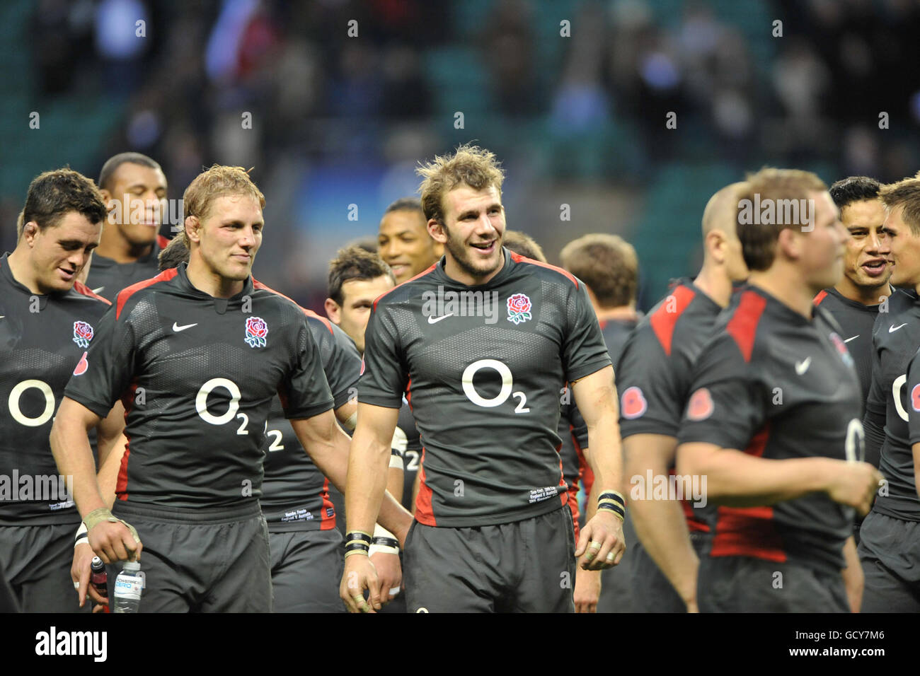 England's Tom Croft (centre) is all smiles as he and team-mates ...
