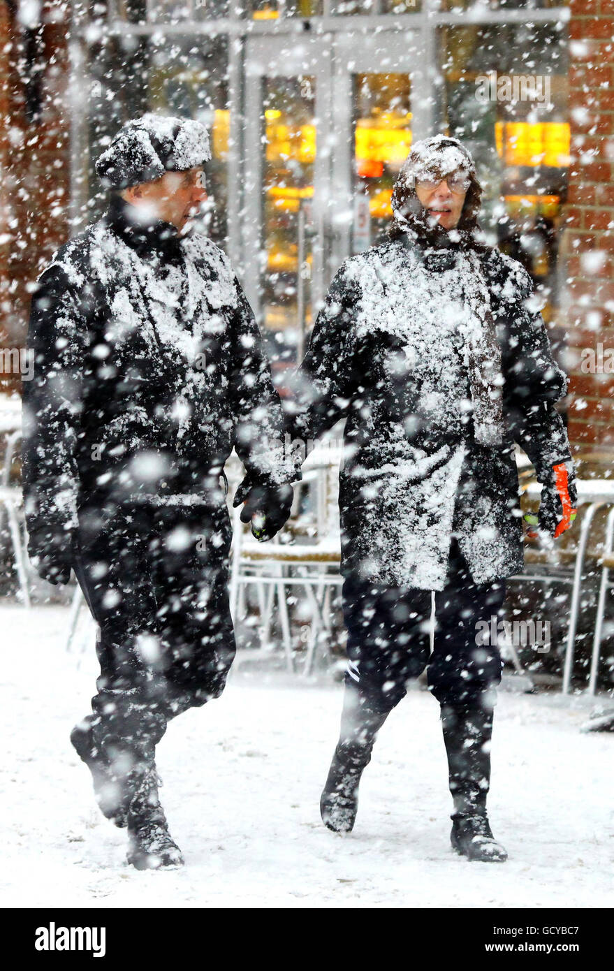 A couple brave a snow storm in Tunbridge Wells, Kent, as the predicted ...