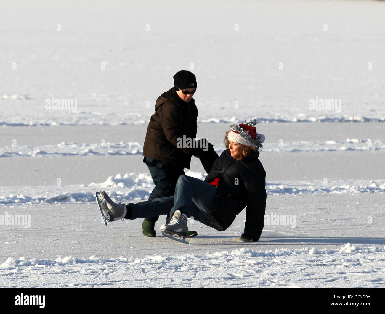 Christmas 2010. Becky Saunders takes a tumble whilst ice skating with ...
