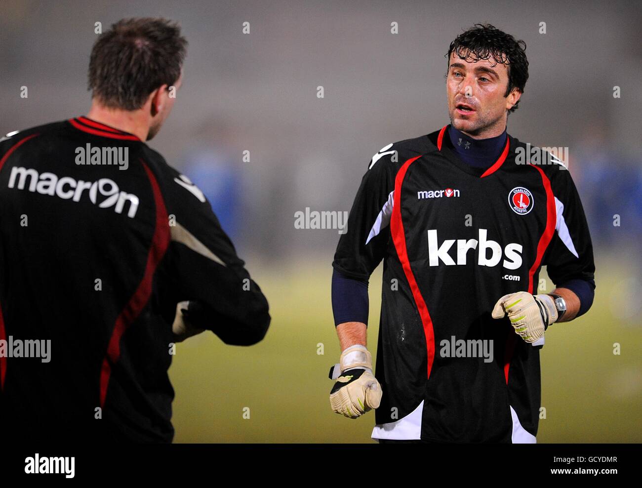 Charlton Athletic goalkeeper coach Ben Roberts talks to goalkeeper Rob ...