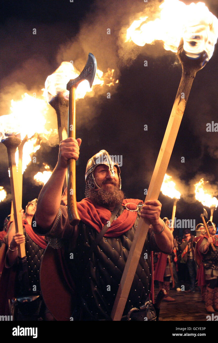 Torch carriers proceed up Edinburgh's Royal Mile to Calton Hill ...