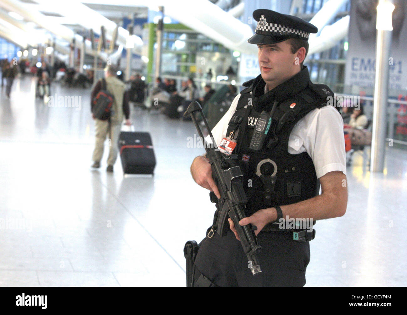An armed police officer on patrol at Heathrow Airport's Terminal 5, as ...