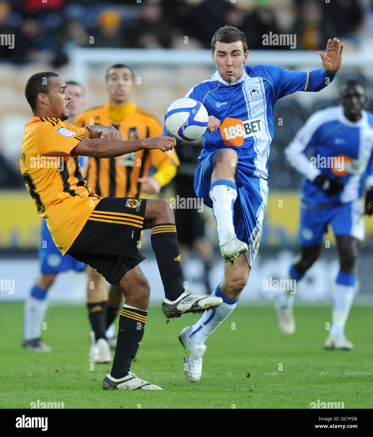 Hull City's Jay Simpson (left) and Wigan Athletic's James McArthur ...